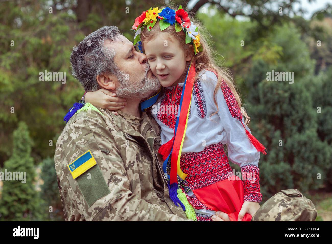 Little Ukrainian girl meets dad from the war. Ukraine, conflict, war ...
