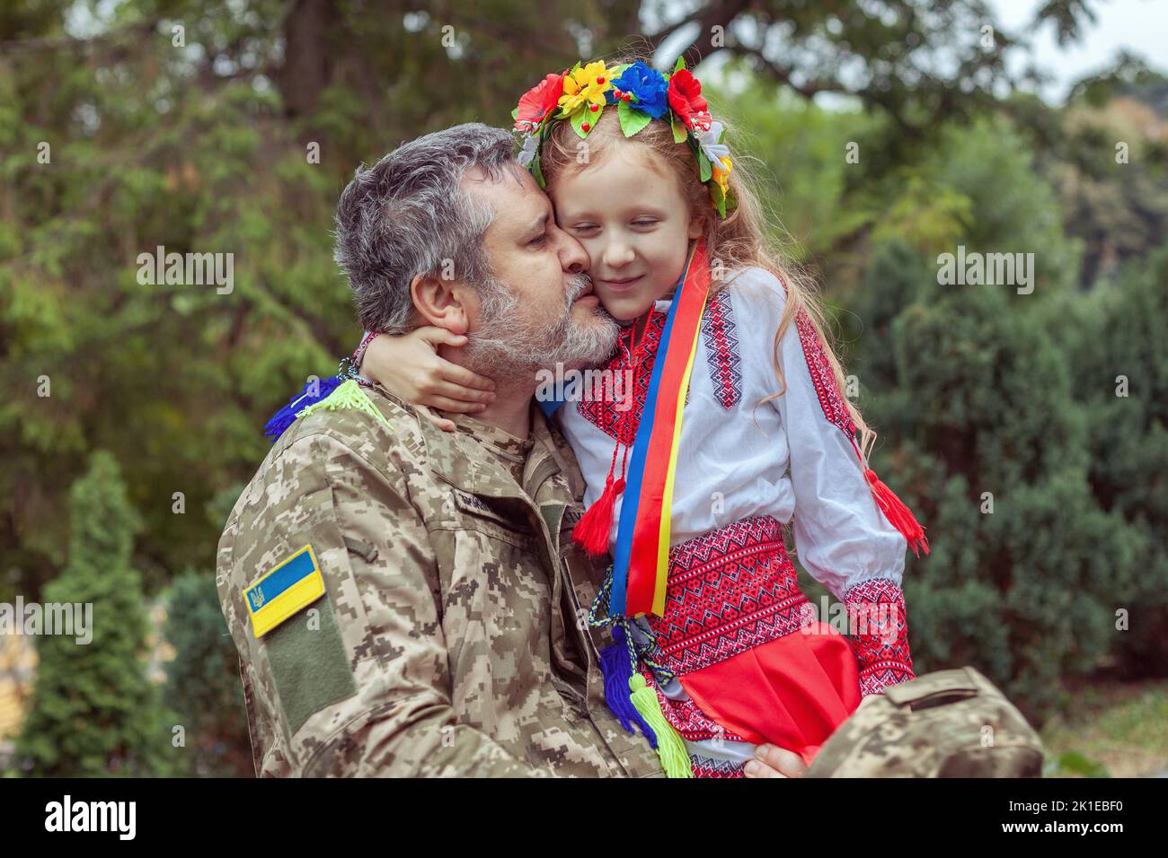 Little Ukrainian girl meets dad from the war. Ukraine, conflict, war ...