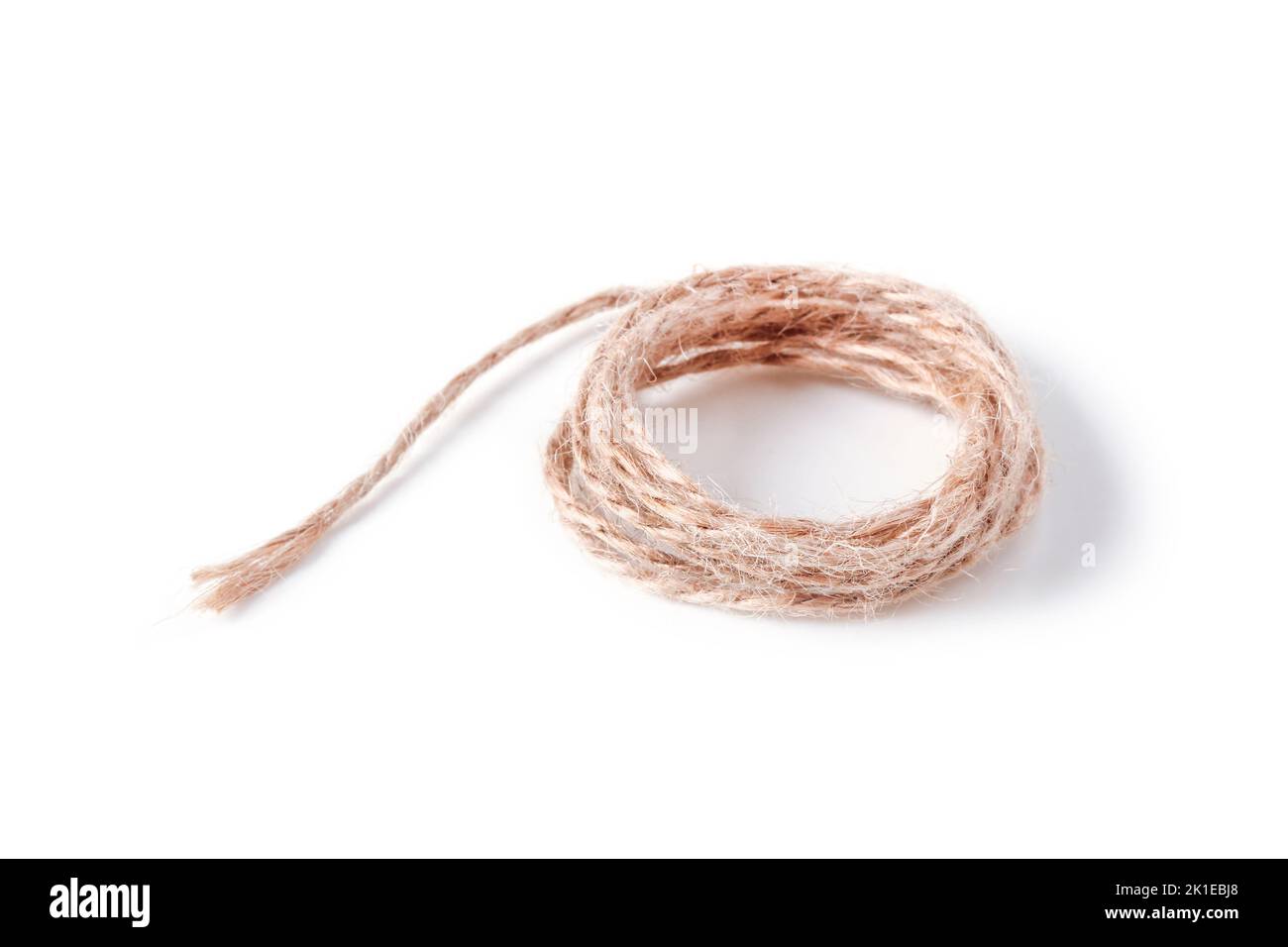 Piece of twisted hemp isolated on white background Stock Photo - Alamy