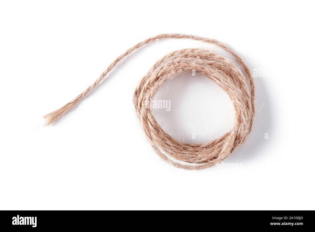 Piece of twisted hemp isolated on white background. View from above ...