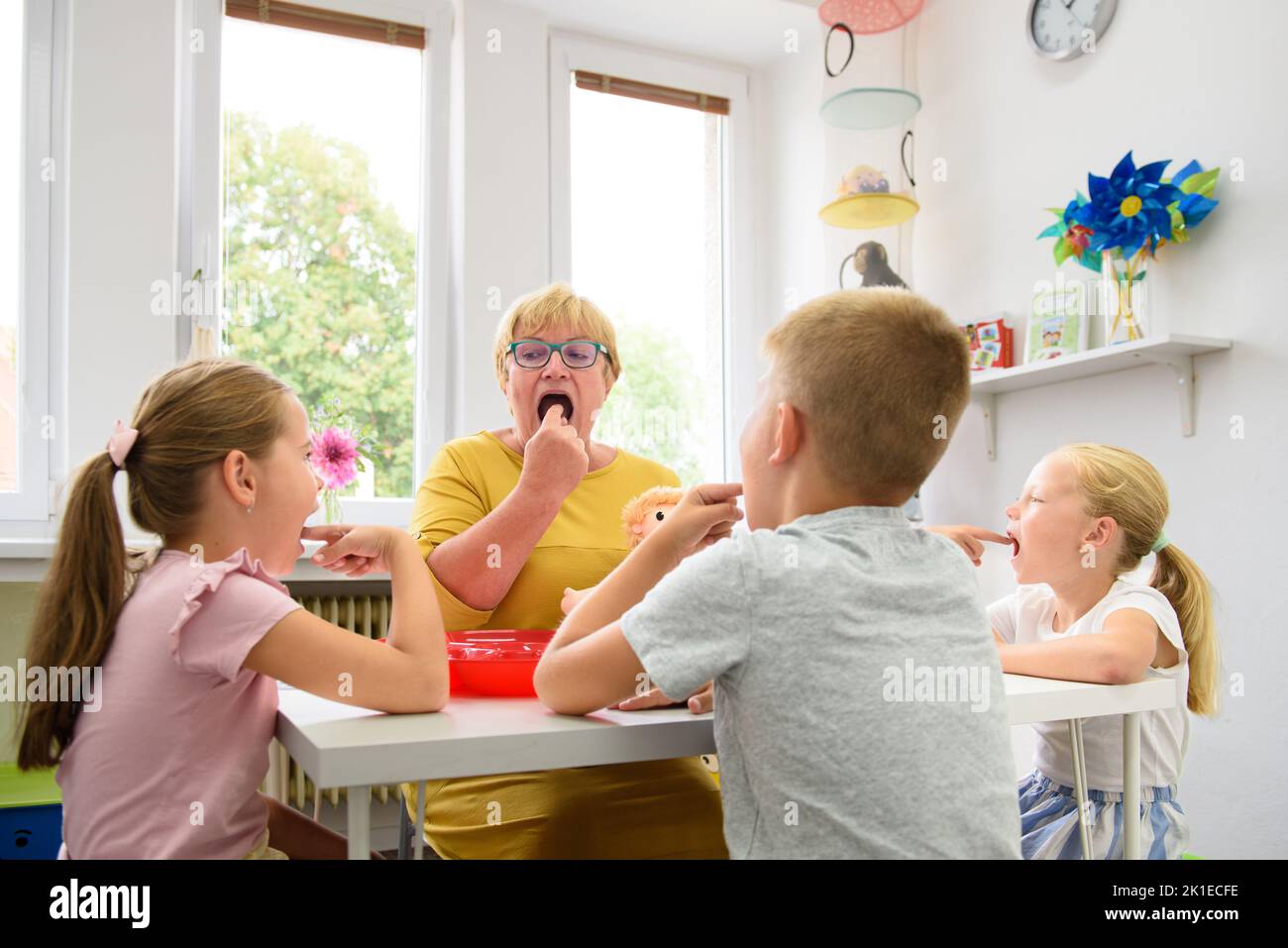 Children speech therapy concept. Children practicing correct ...