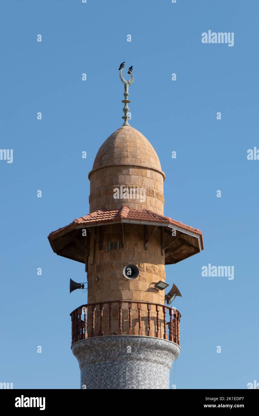 Minaret of Al-Ajami Mosque topped by an alem metal finial incorporating ...