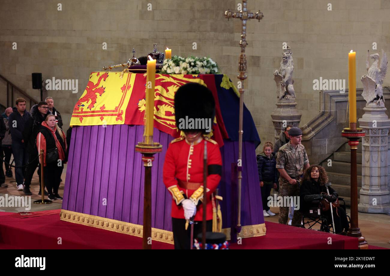 Members of the public view the coffin of Queen Elizabeth II, lying in ...