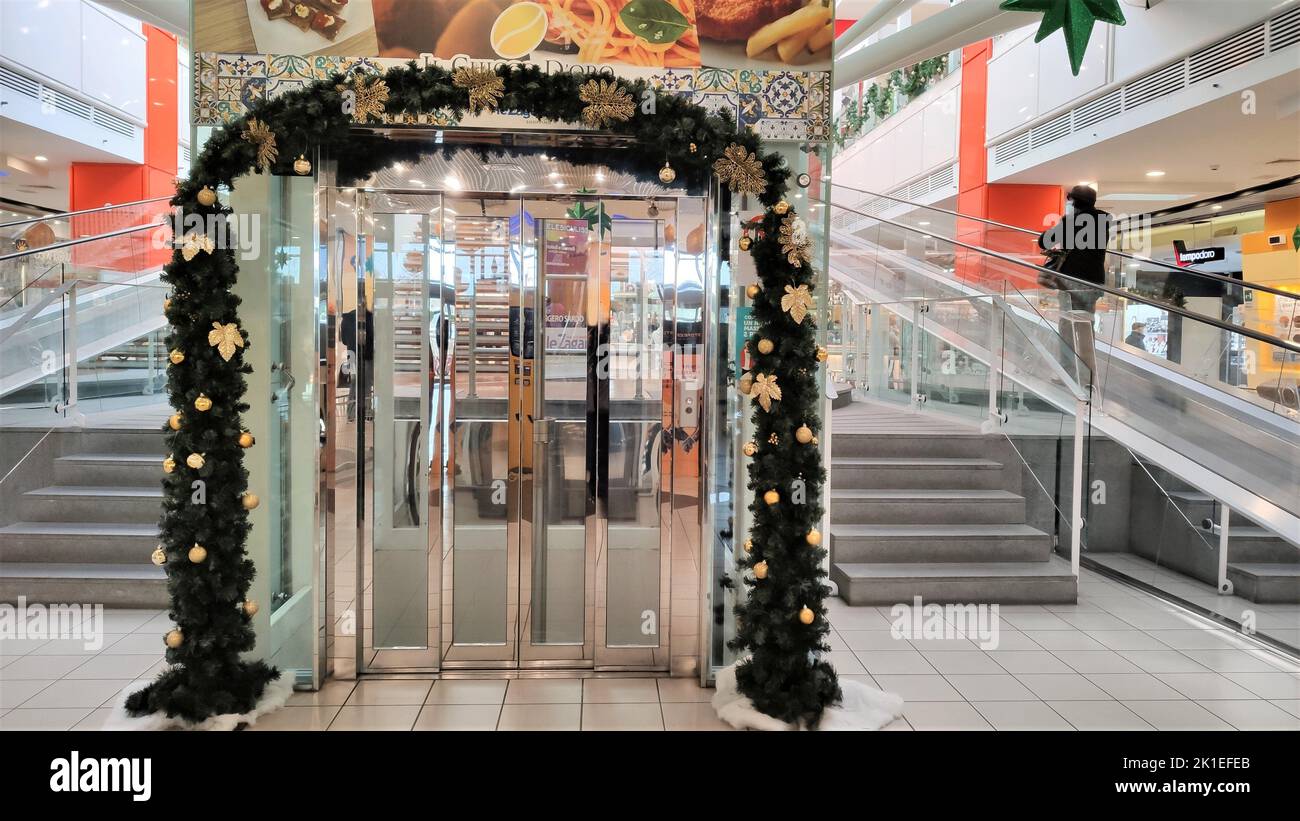 Christmas decorations and storefronts in the background at shopping ...