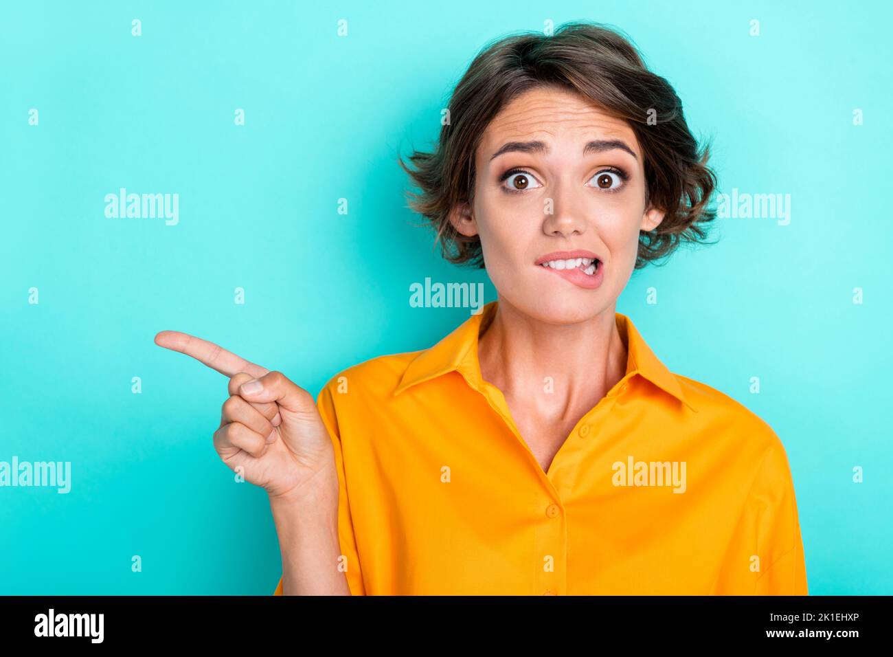 Portrait of impressed excited staring woman wear yellow shirt ...