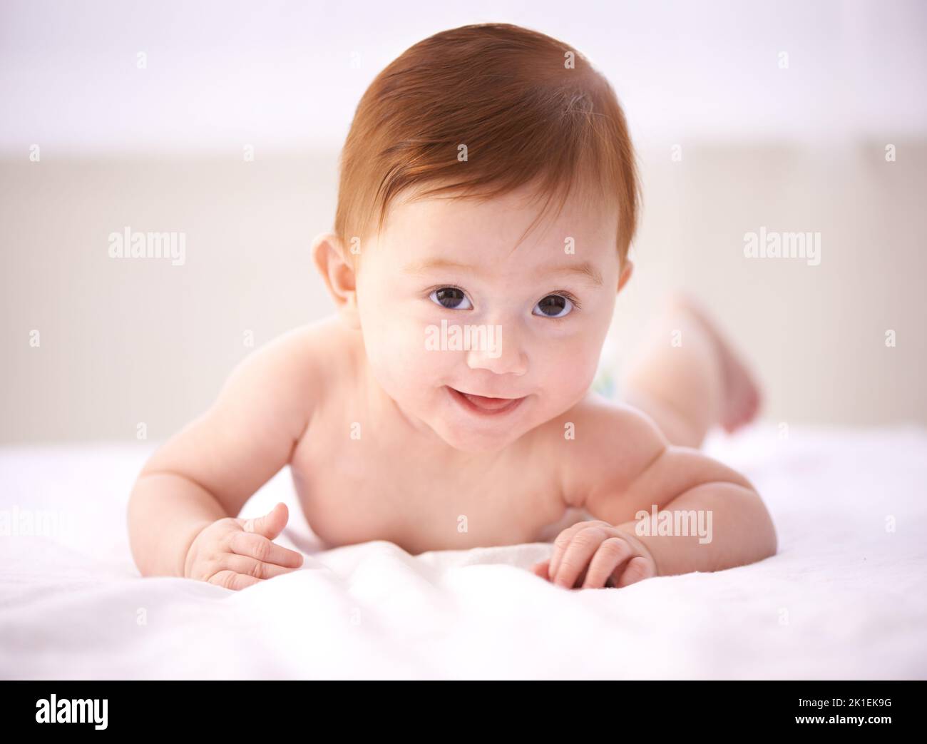 As cute as cute can be. an adorable baby girl with red hair Stock Photo ...