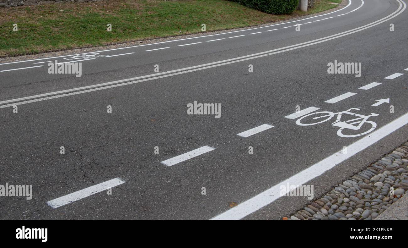 Asphalt road with bike lane stripes Stock Photo - Alamy