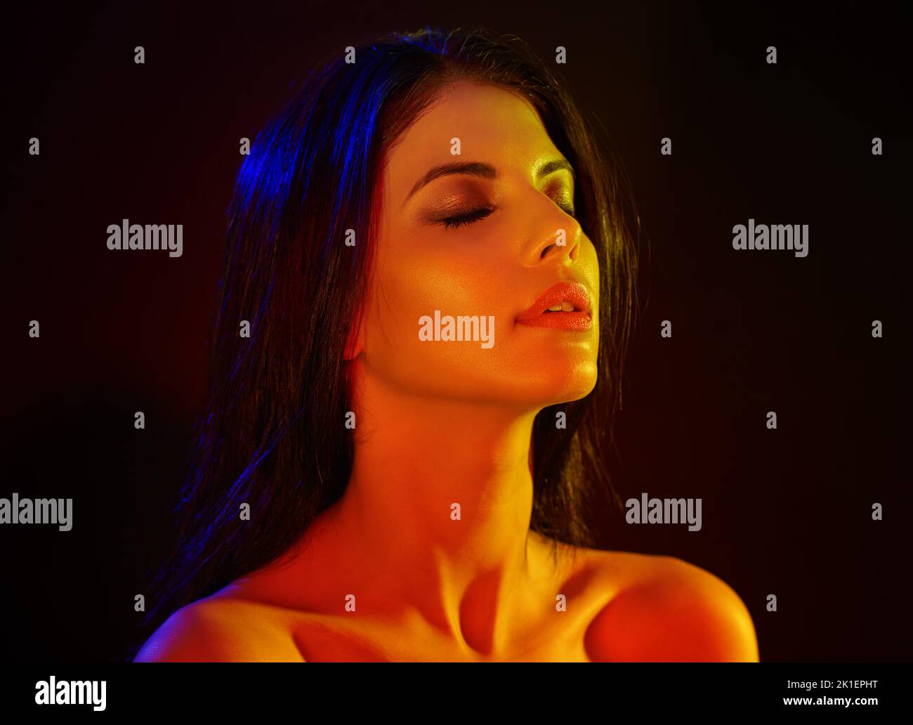 Colour her beautiful. Studio shot of a beautiful young woman with ...
