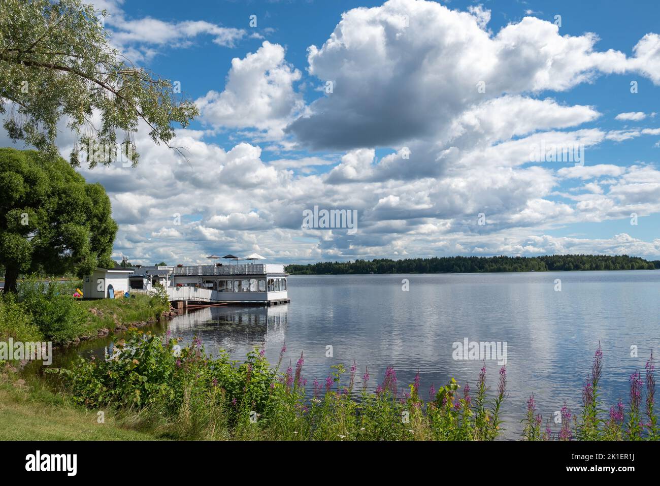 Floating restaurant on the beach outside the town of Mora on Lake ...