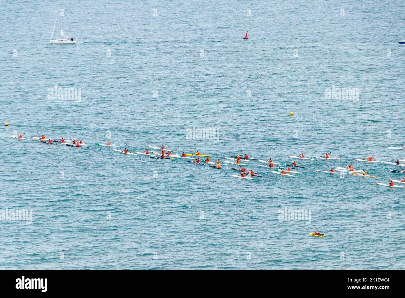 canoes and canoeists racing Epic Bay Ocean Race 2022 Exmouth Beach ...
