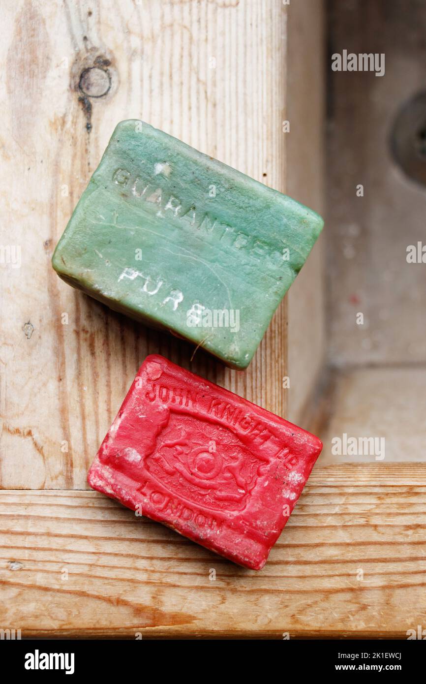 vintage green and red bars of soap in old English house washroom or ...