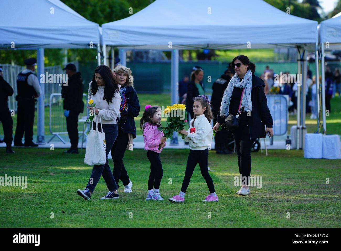 Members of the public pass through a police screening area on the Long ...