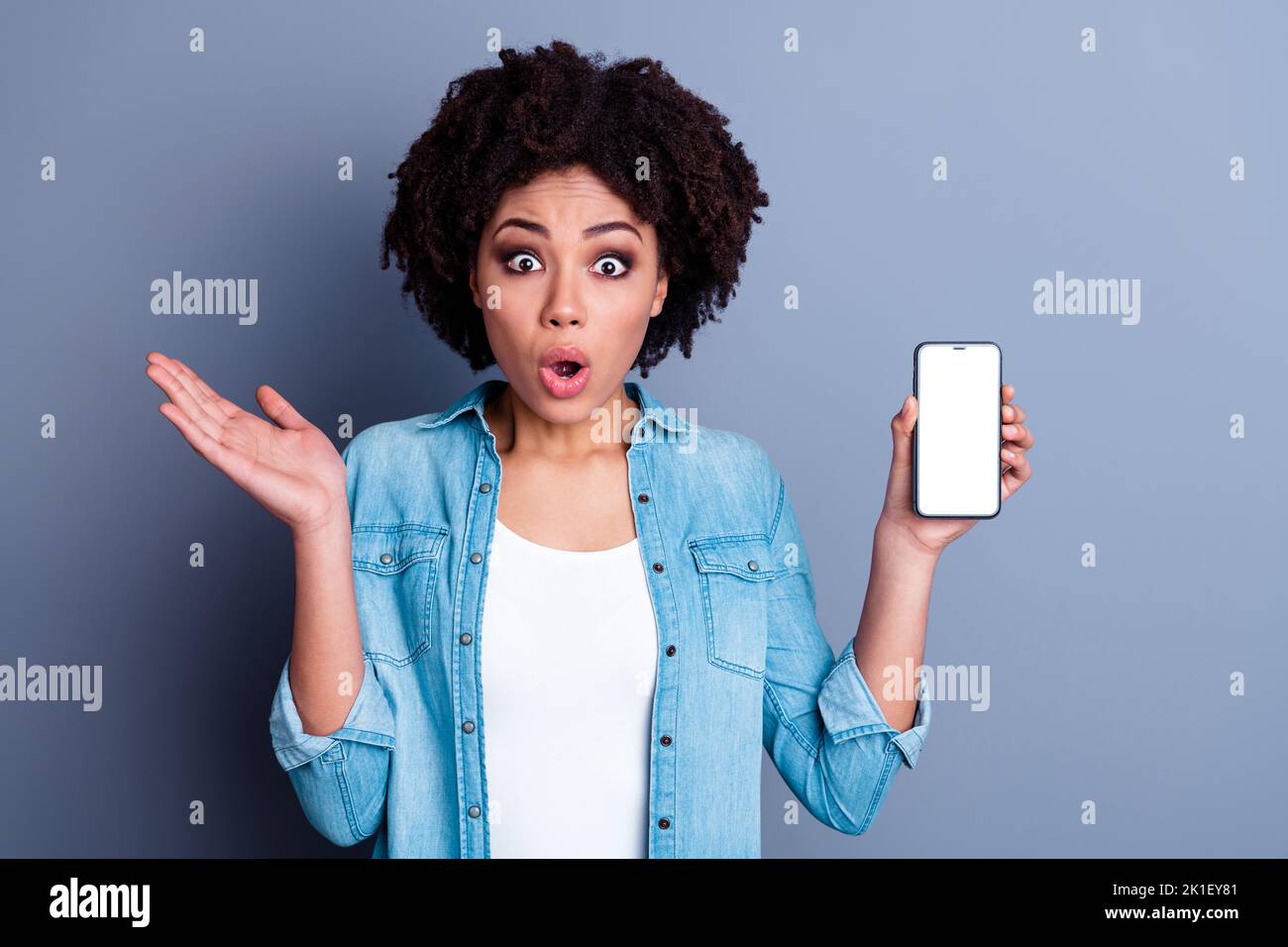 Photo of impressed confused person hand hold show empty space telephone ...