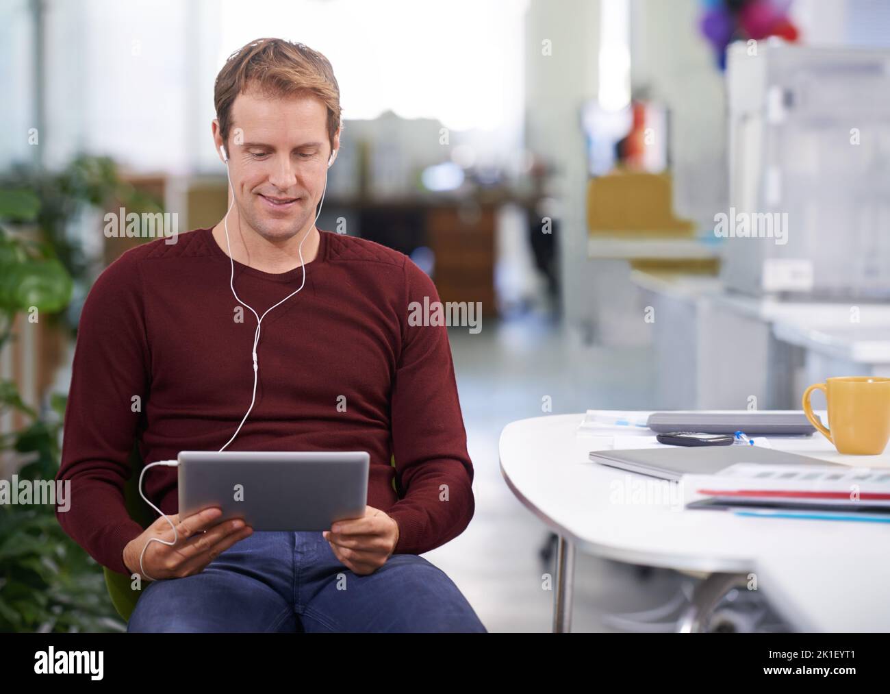 Take a little break from work. A handsome businessman working at his ...