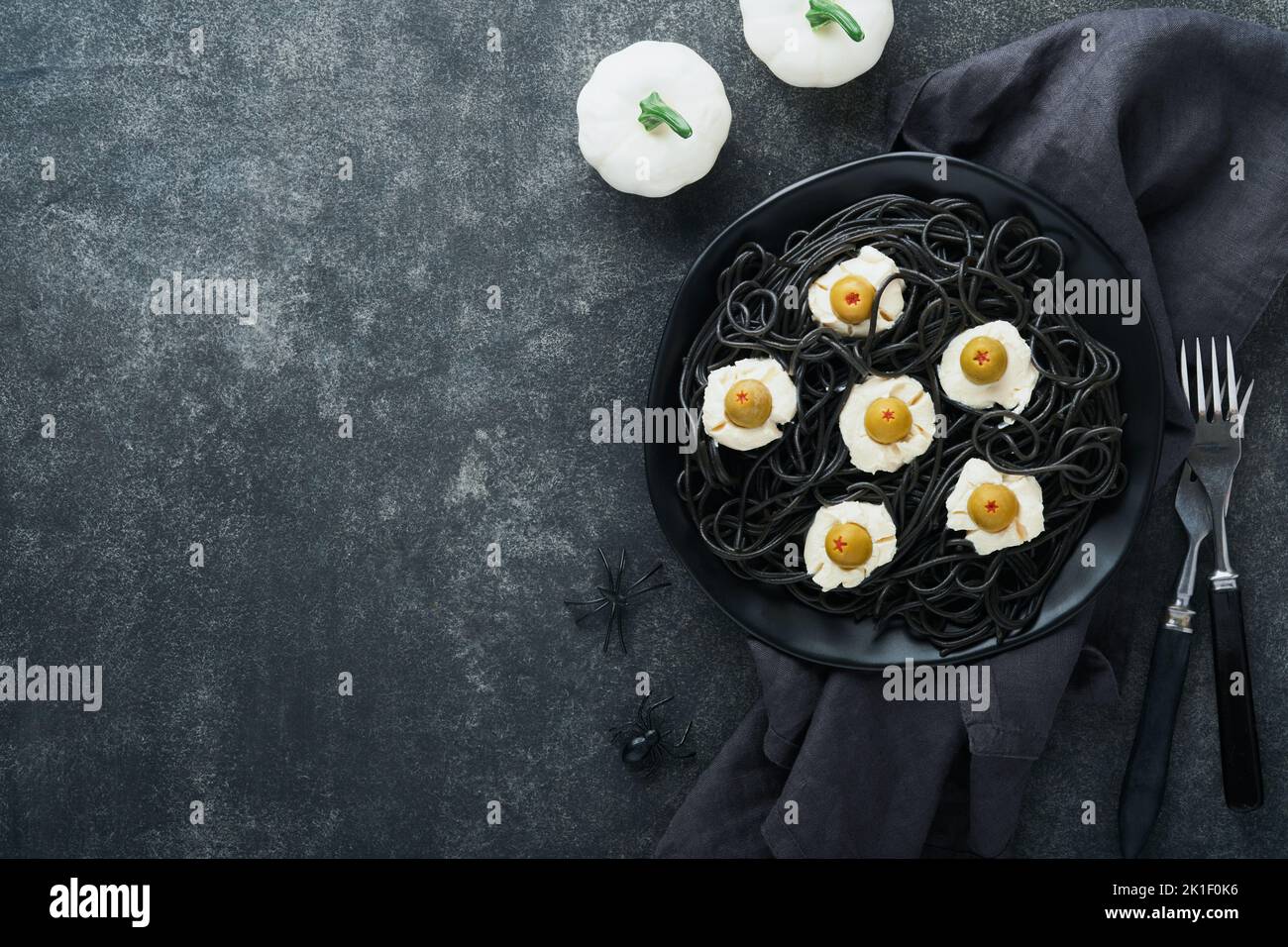 Halloween party Italian black pasta decorated horror olives like eyes ...