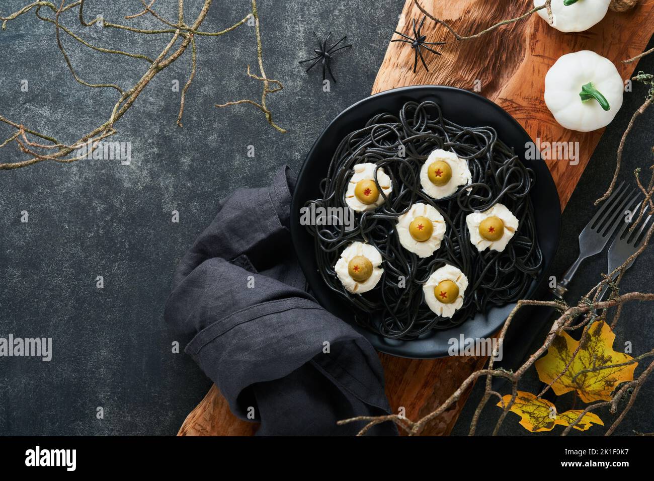 Halloween party Italian black pasta decorated horror olives like eyes ...