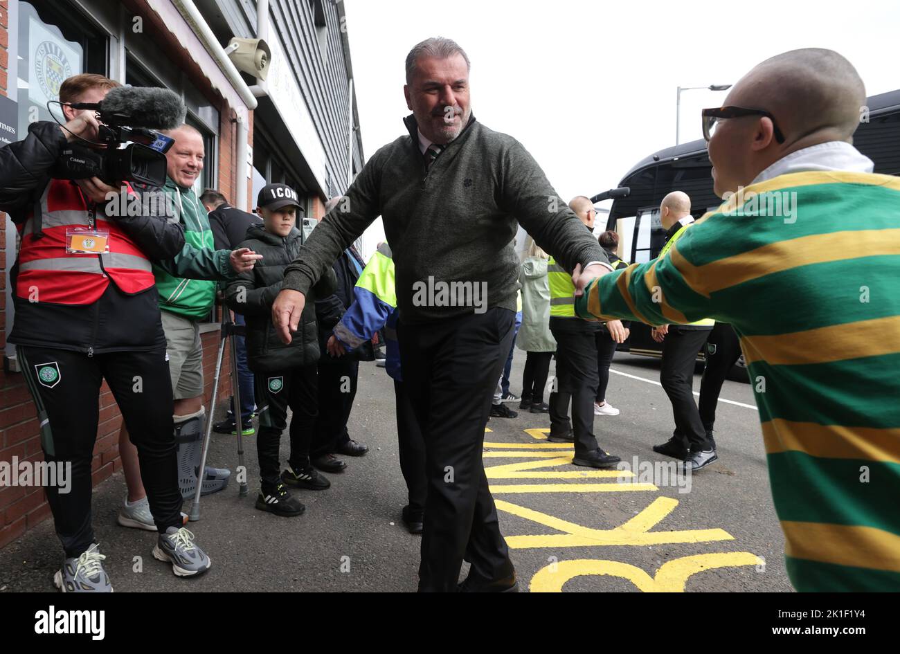 Celtic manager Ange Postecoglou greets a fan before the cinch ...