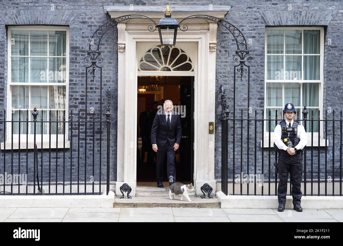 Irish Taoiseach Micheal Martin tries to stroke Larry the cat as he ...