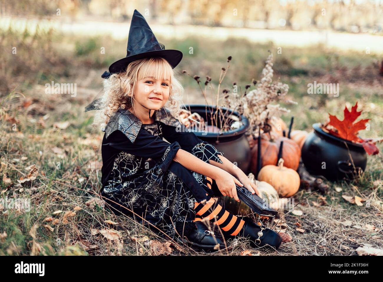 Beautiful girl witch. little girl in which costume celebrate Halloween ...