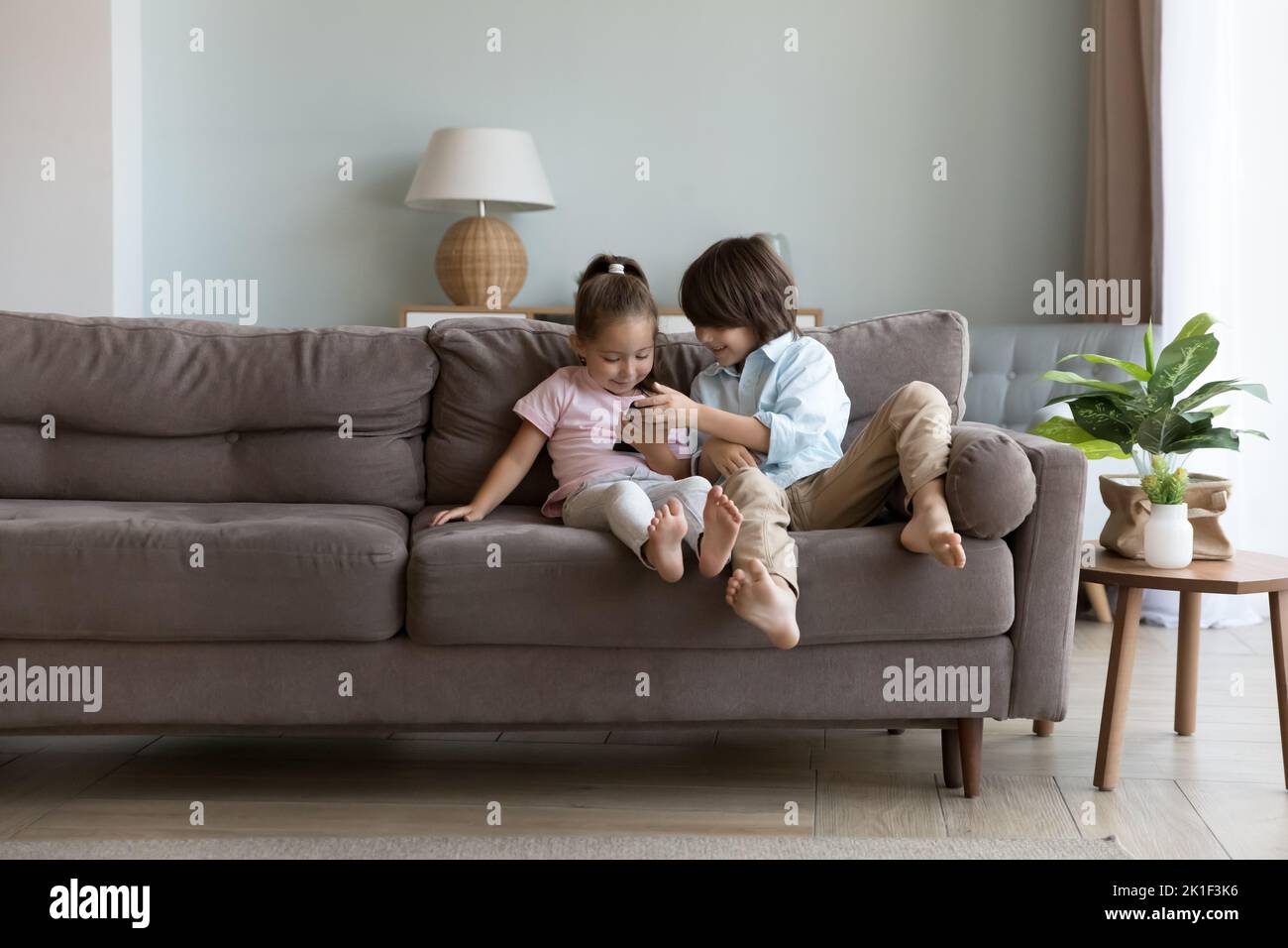Two gen Z brother and sister kids playing video games Stock Photo - Alamy