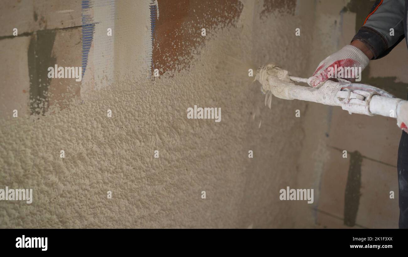 A wall being covered in a layer of plaster Stock Photo - Alamy