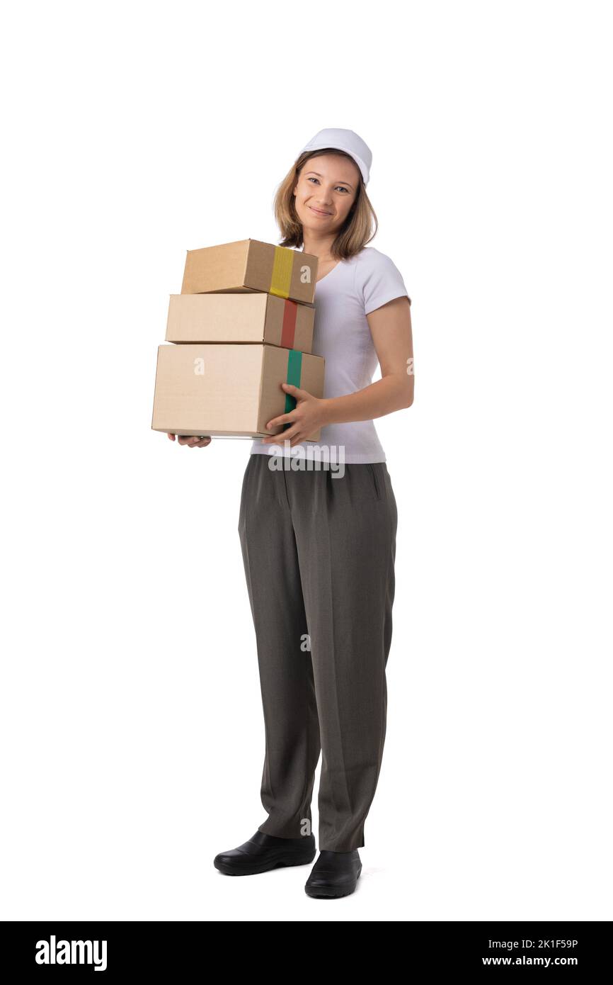 Full length portrait of delivery woman in white cap, t-shirt giving ...
