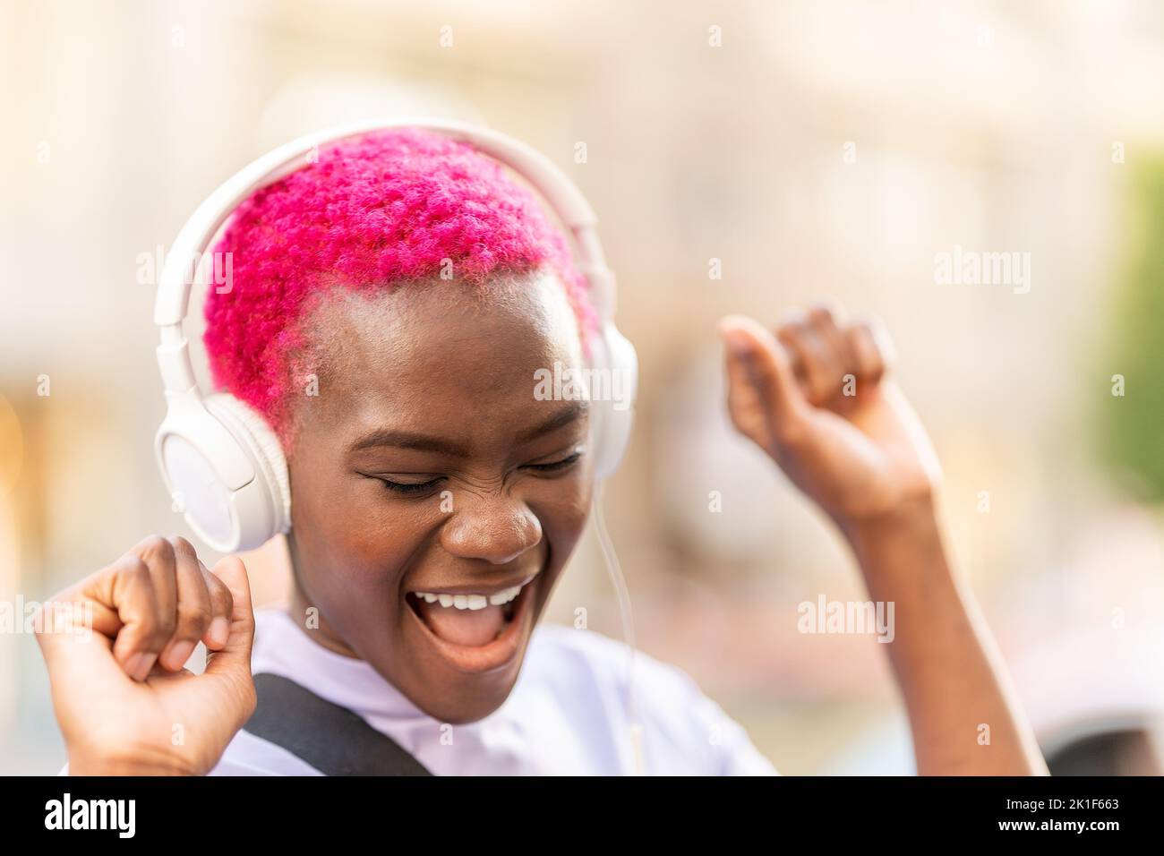 African woman dancing while listening to music outdoors Stock Photo - Alamy African woman dancing while listening to music outdoors Stock Photo - Alamy