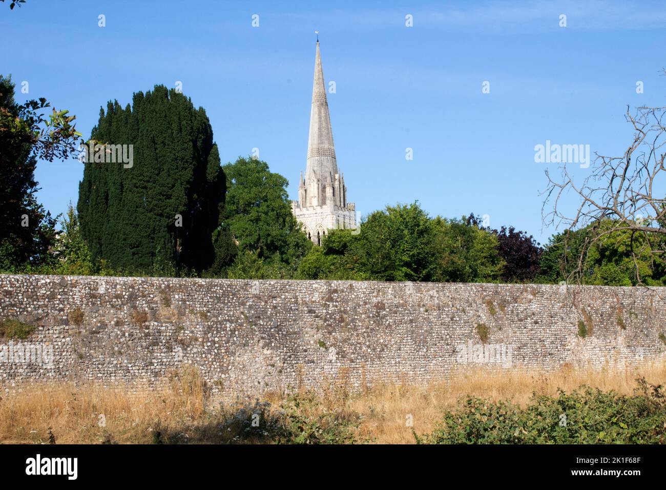 Chichester's Roman walls with the spire of Chichester cathedral ...