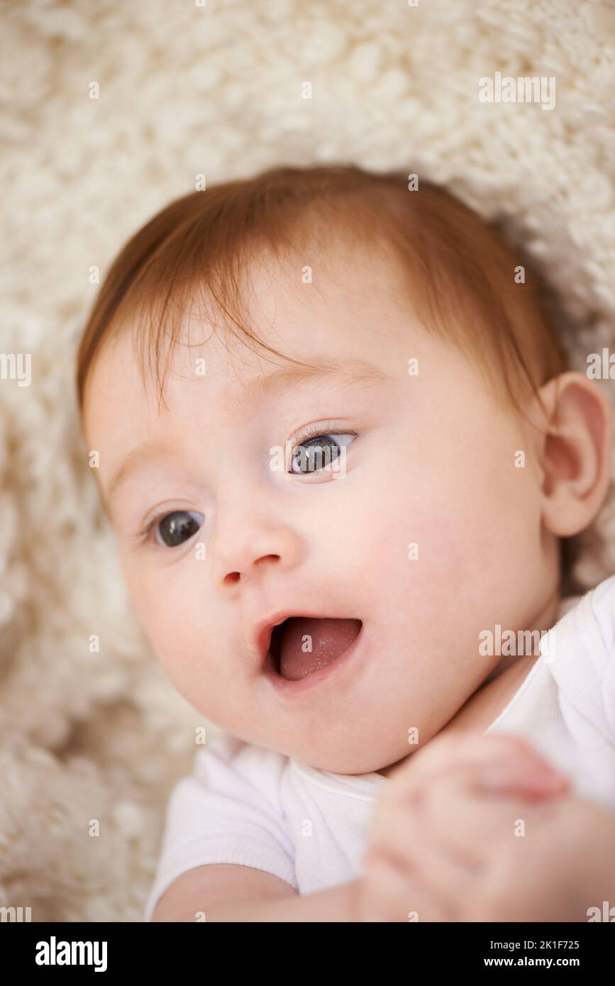 A whole new world. an adorable baby girl with red hair Stock Photo - Alamy
