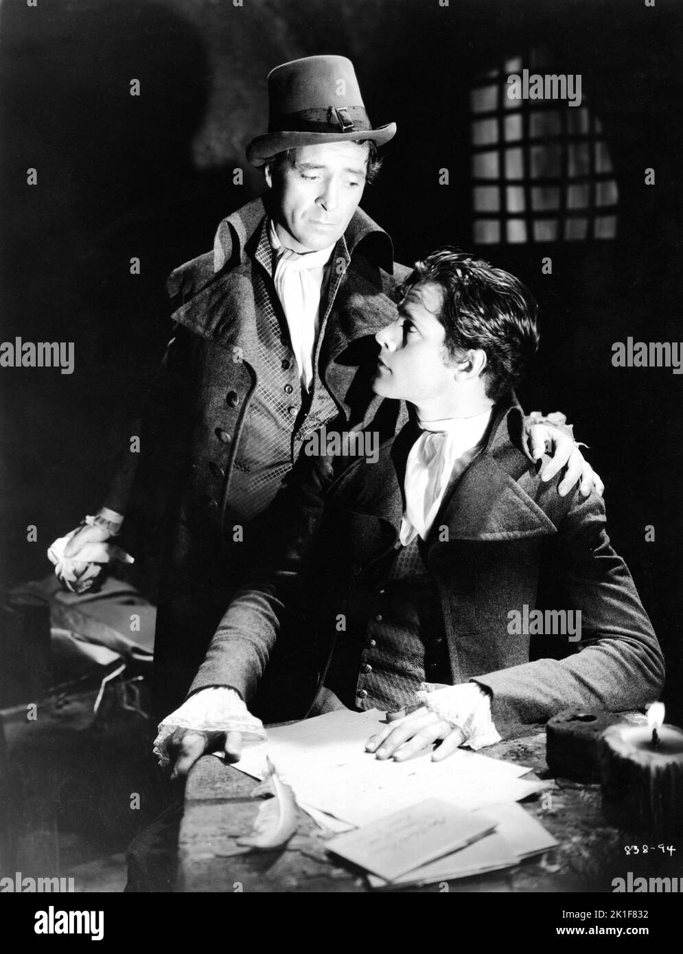 RONALD COLMAN as Sydney Carton and DONALD WOODS as Charles Darney in A ...