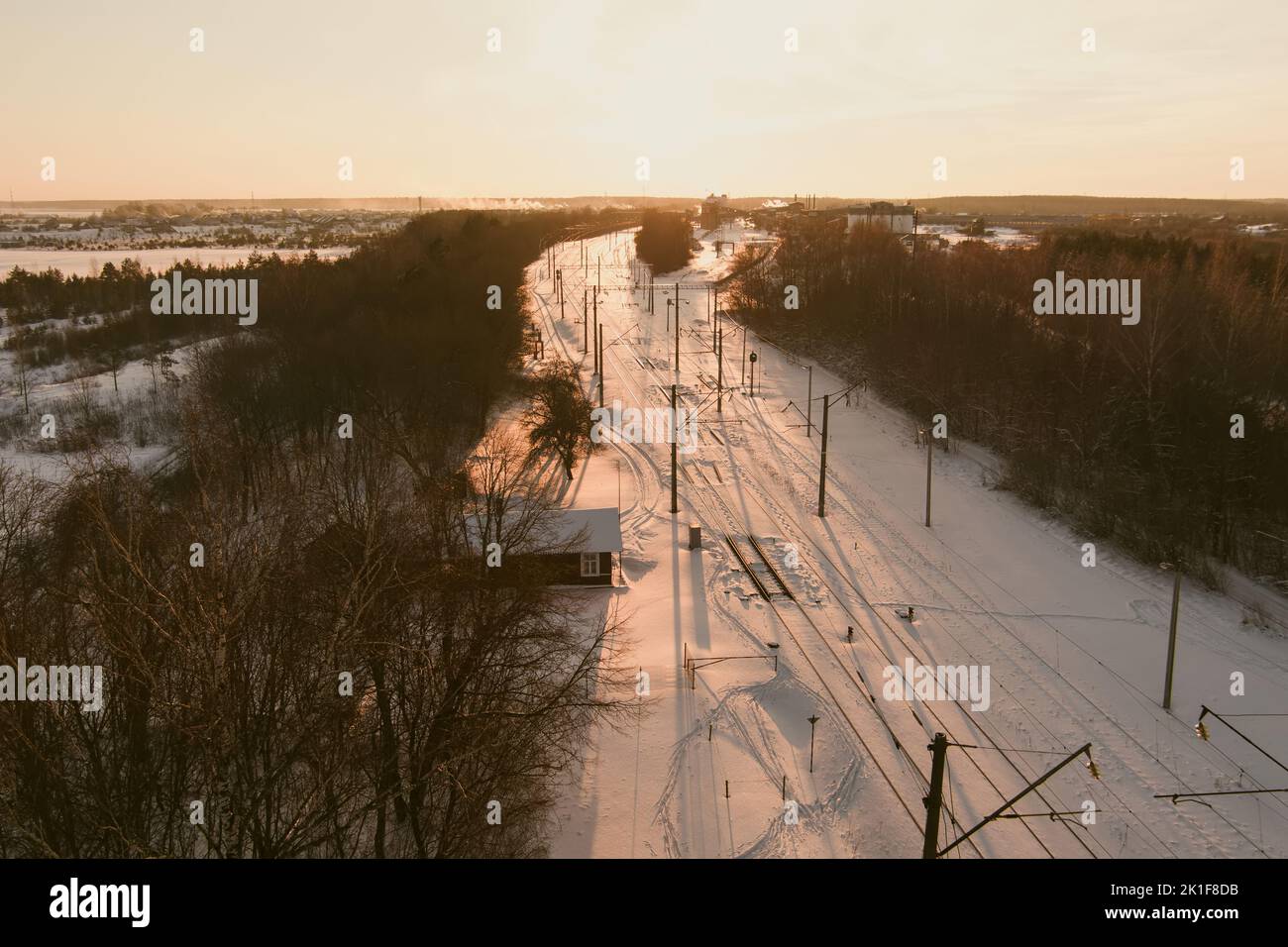 Aerial view of a railroad among pine forests at winter. Winter scenery ...