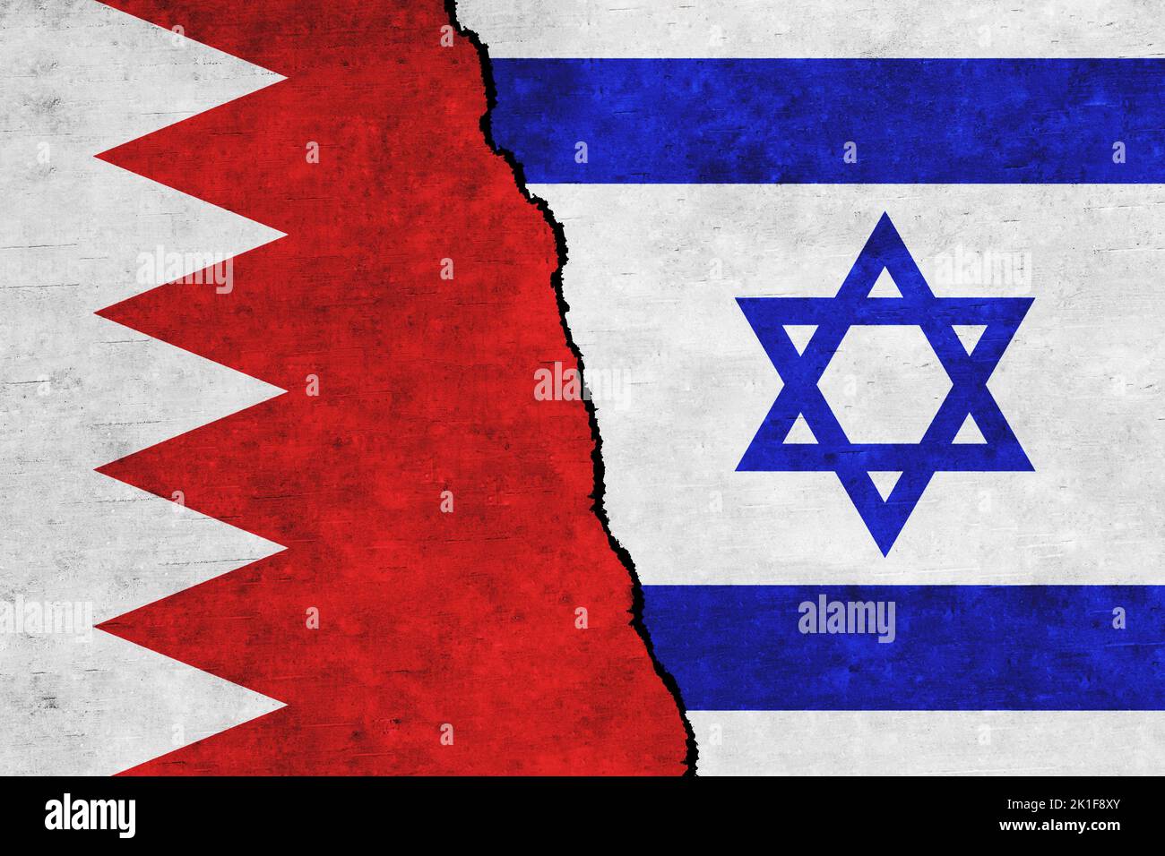 Israel and Bahrain painted flags on a wall with a crack. Israel and ...