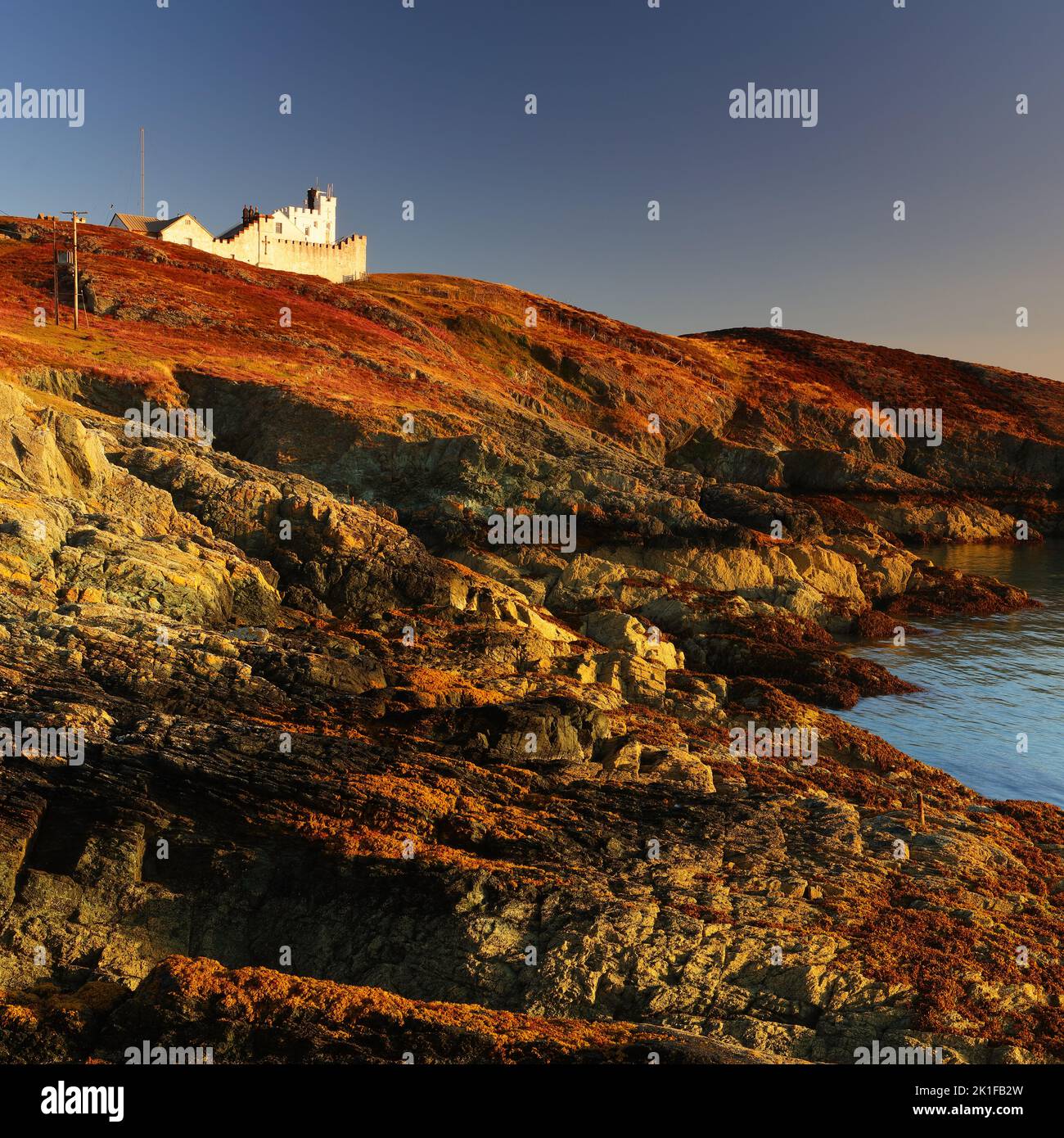 Warm Morning light on Point Lynas Lighthouse. Anglesey, North Wales, UK ...