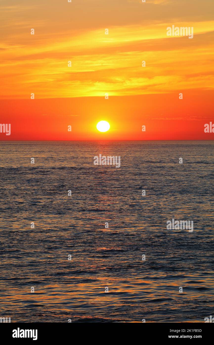 Beautiful Orange Sunset over the ocean. Anglesey, North Wales, UK Stock ...