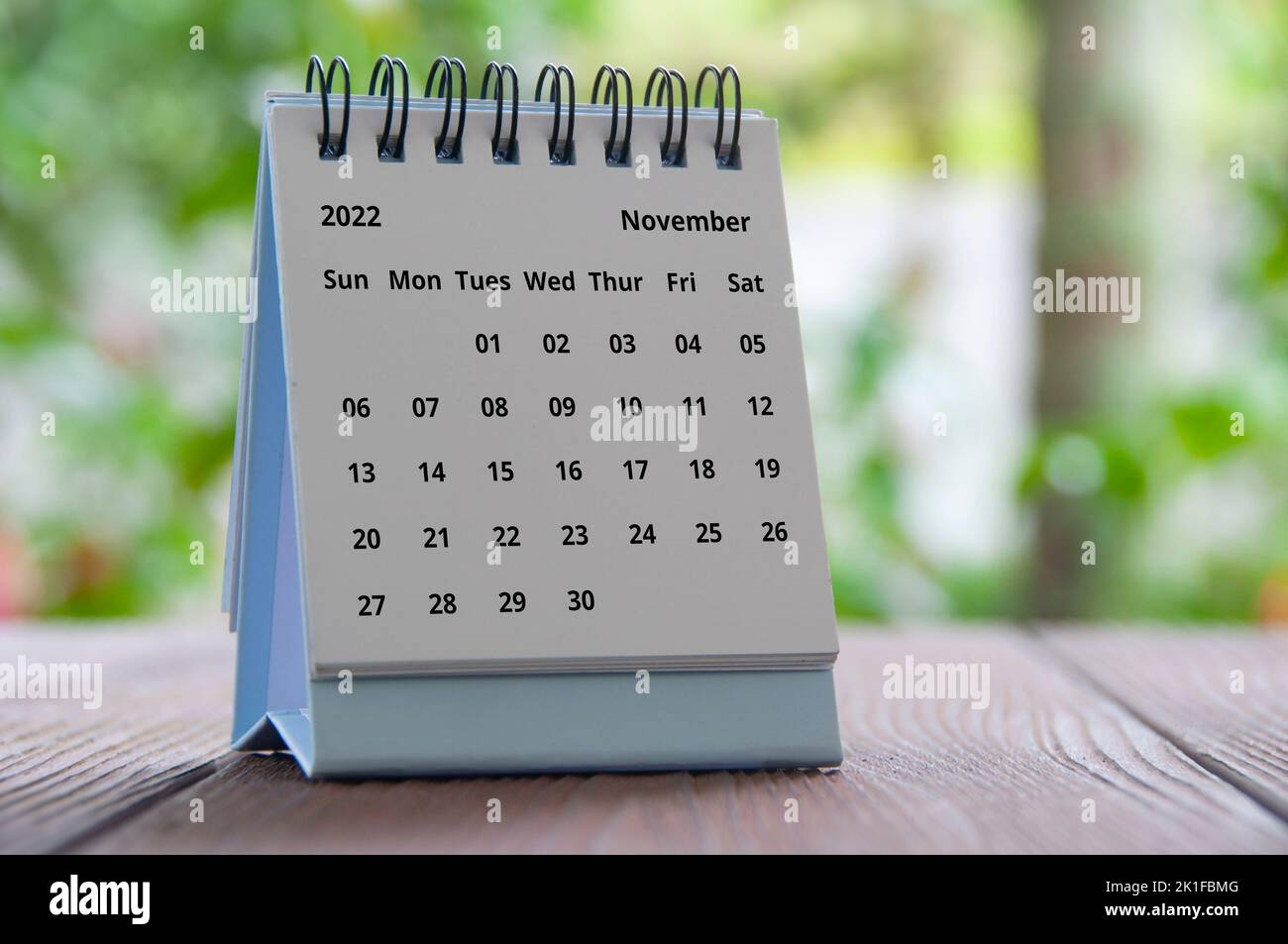 November 2022 table calendar with blurred nature background. Calendar ...