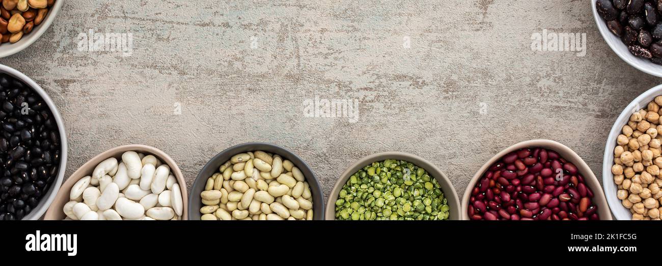Banner of various types of legumes in bowls, green and yellow peas ...