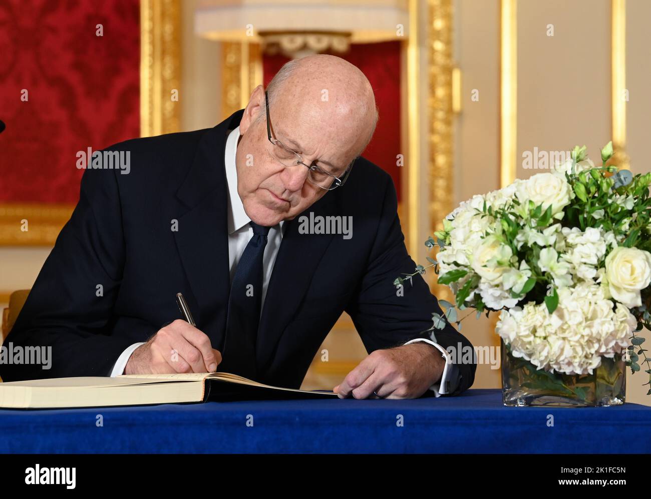 Prime Minister of Lebanon Najib Mikati signs a book of condolence at ...