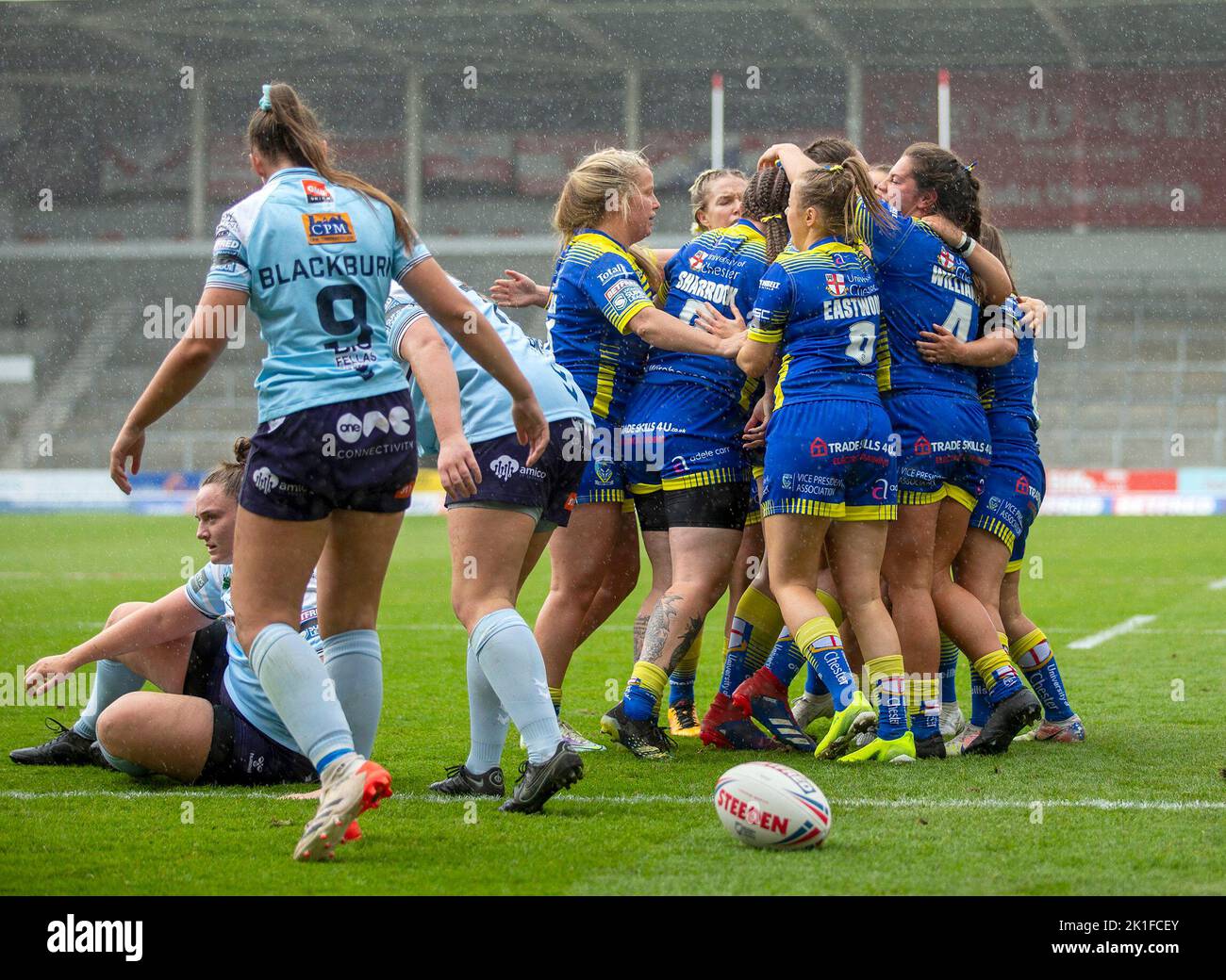 Warrington Wolves’ Amy Johnson celebrates with teammates after scoring ...