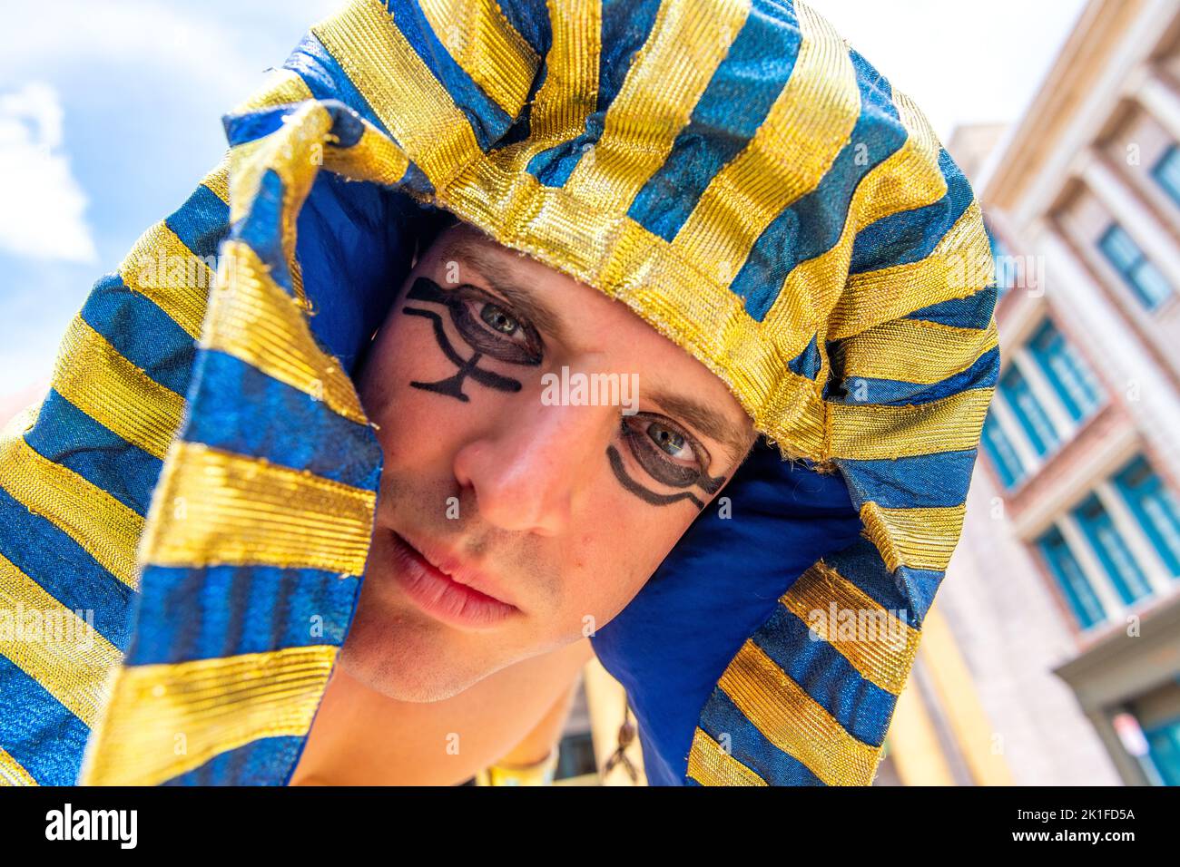 A male entertainer performing in front of the Revenge of the Mummy ...