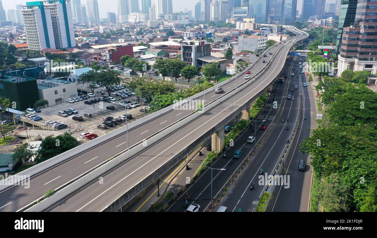 Highway multi-level interchange road with moving cars. Cars are moving ...