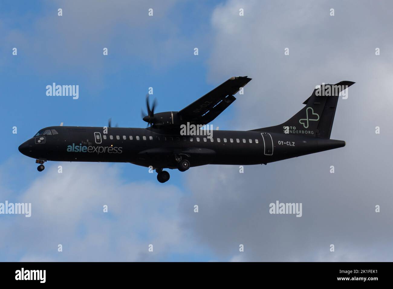An Alise Airways Express ATR 72-500 isolated in the air with clouds in ...