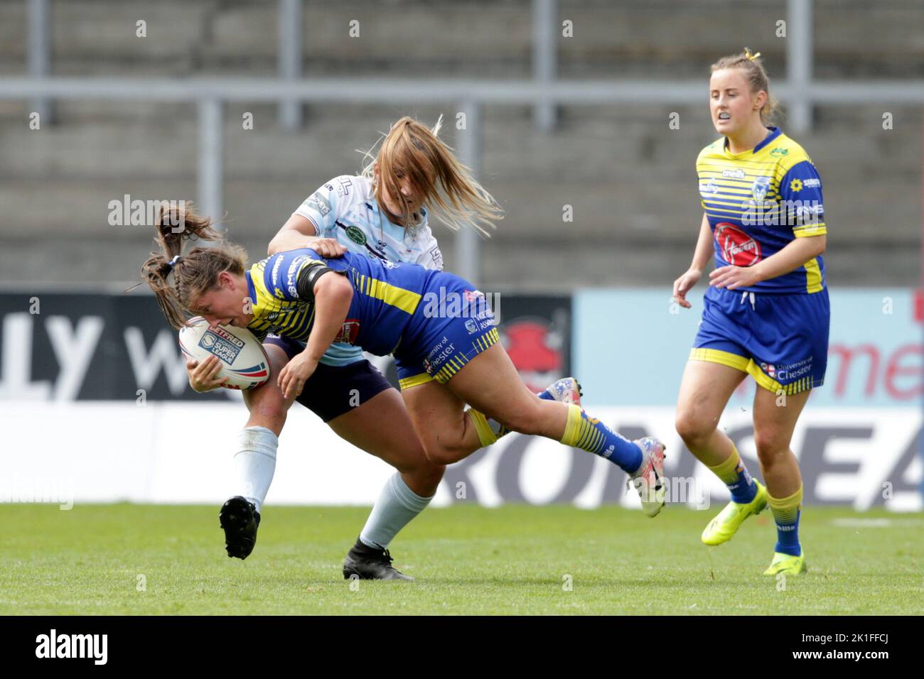 Warrington Wolves’ Keira McCosh is tackled during the Betfred Super ...