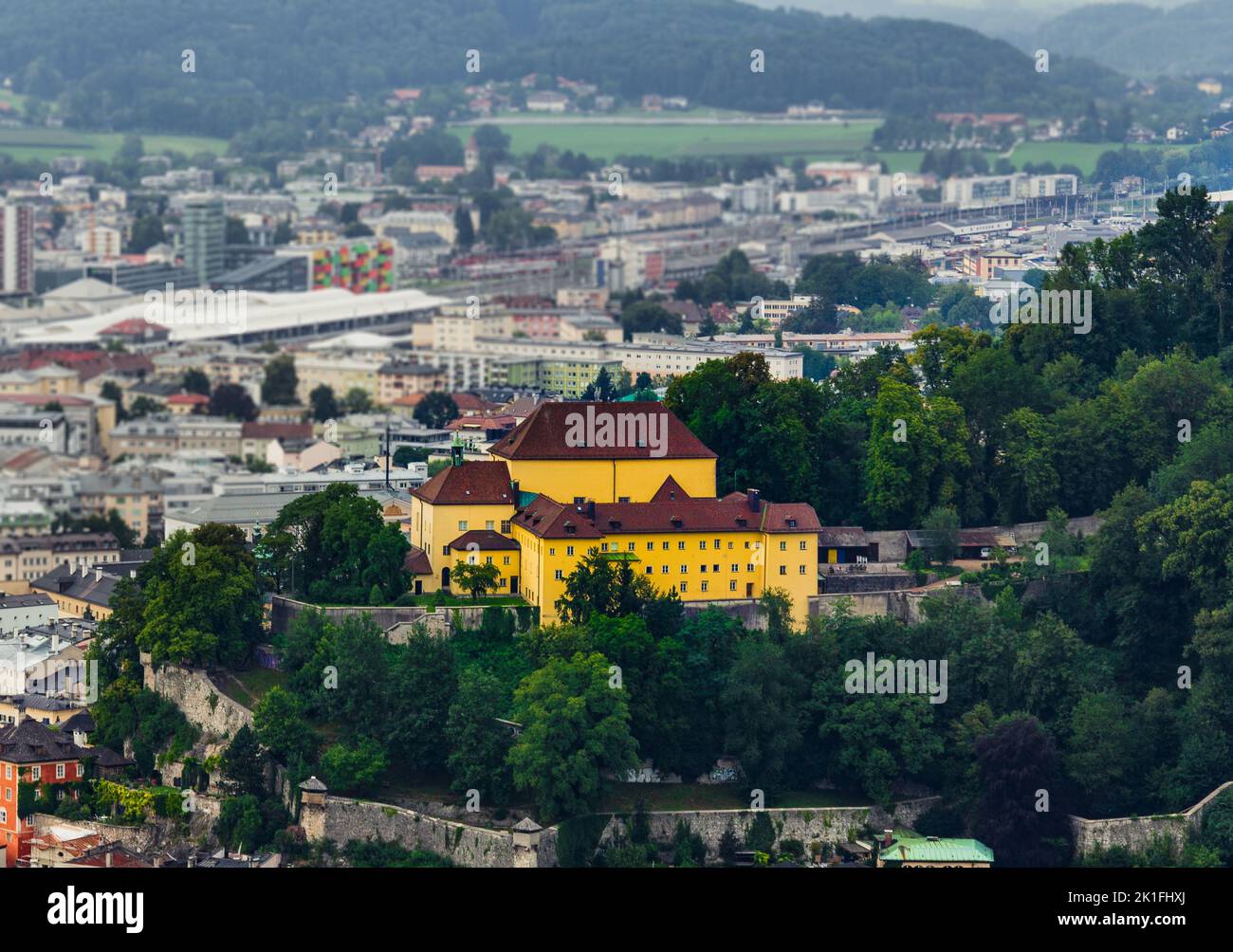 Yellow building on mountain in Salzburg Austria Stock Photo - Alamy