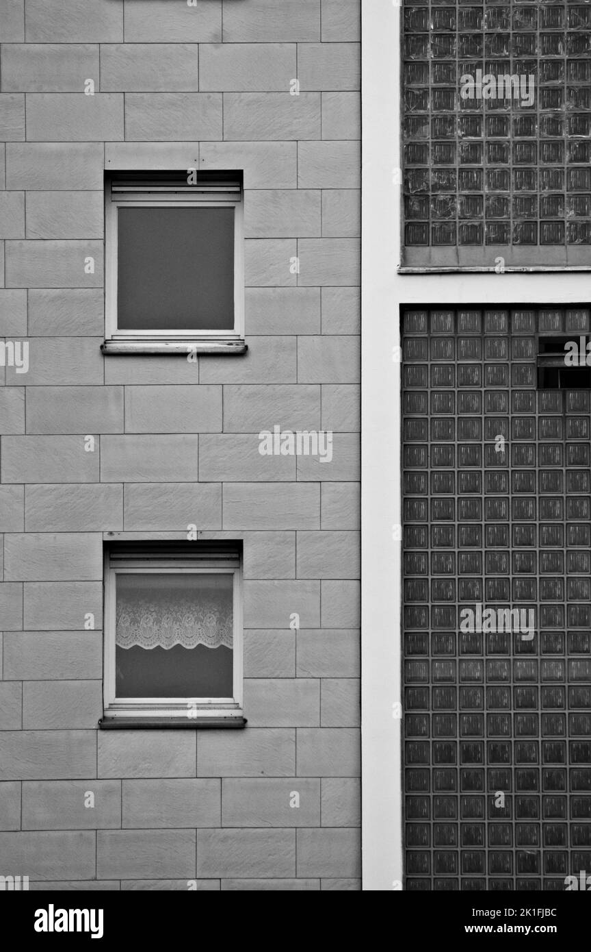 A vertical grayscale shot of dreary architecture in Essen, Germany ...