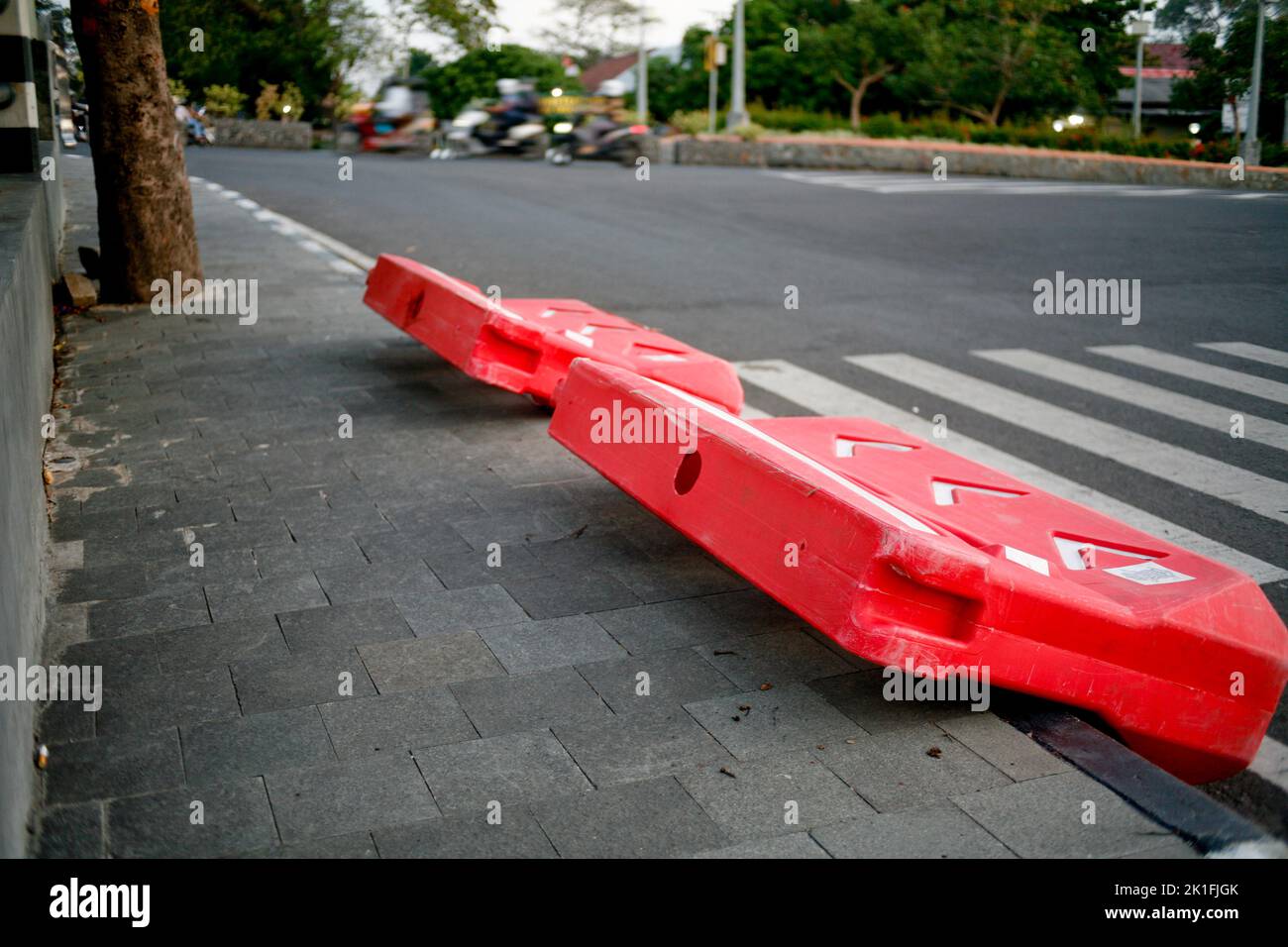 Orange plastic construction barriers on the side of street Stock Photo ...