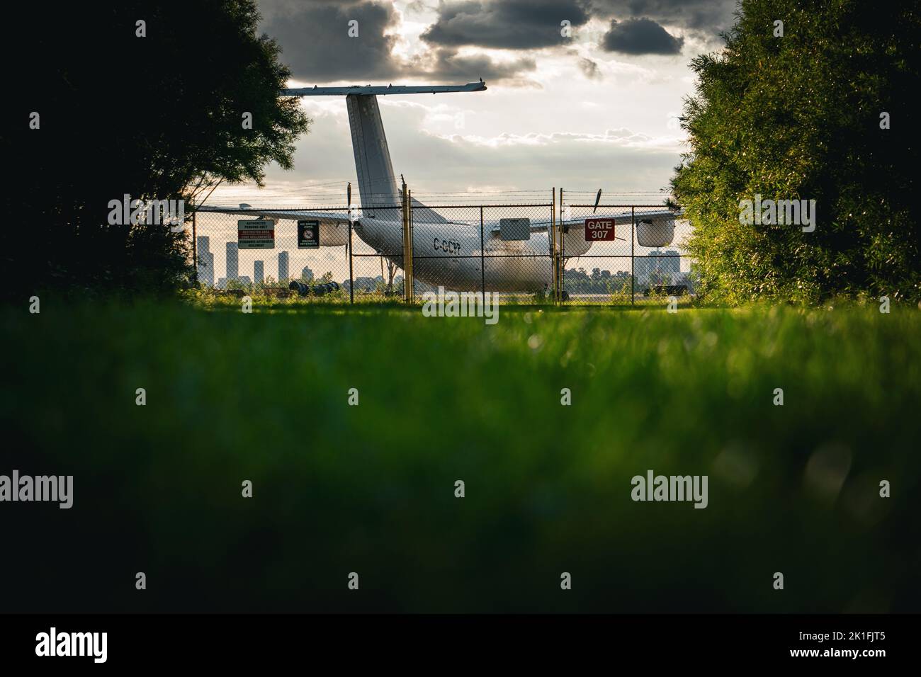 A Trans Capital airplane landing on the runway of Center Island Airport ...