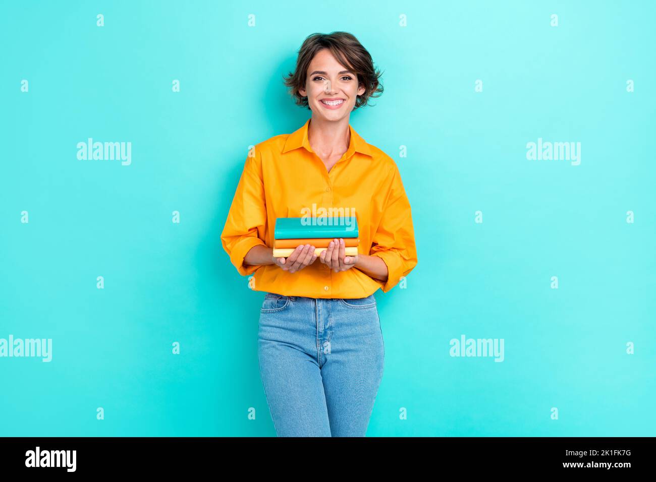 Portrait photo of young adorable gorgeous student woman hold many book ...