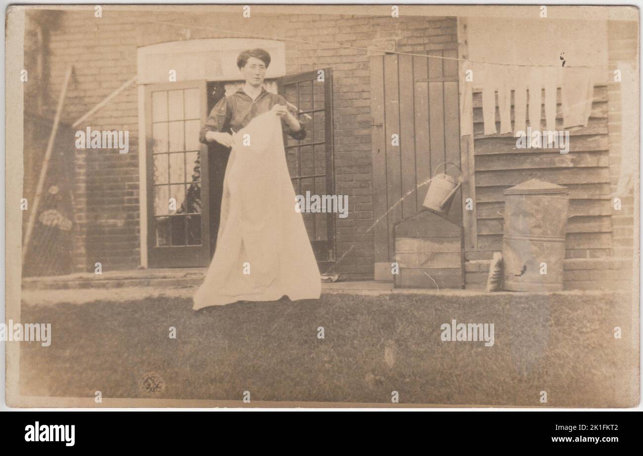 Hanging out the washing, early 20th century. Informal photograph of an ...