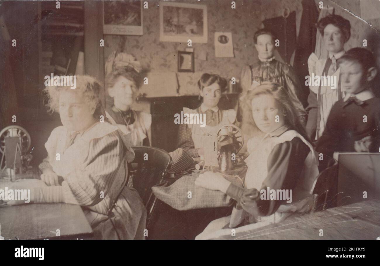 Photograph of a family of home workers with sewing machines set up in a ...