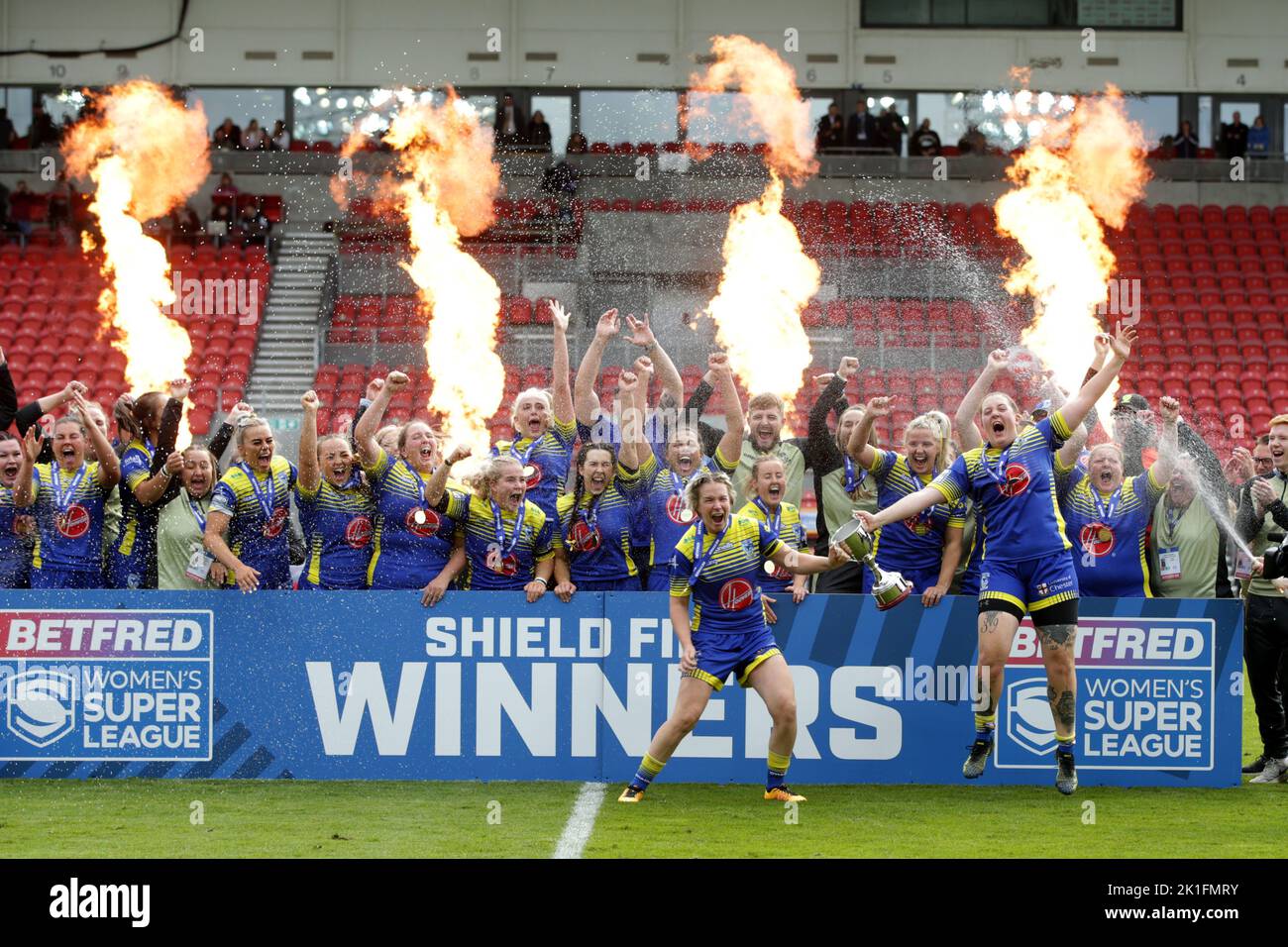 Warrington Wolves players celebrate winning the Shield Final following ...